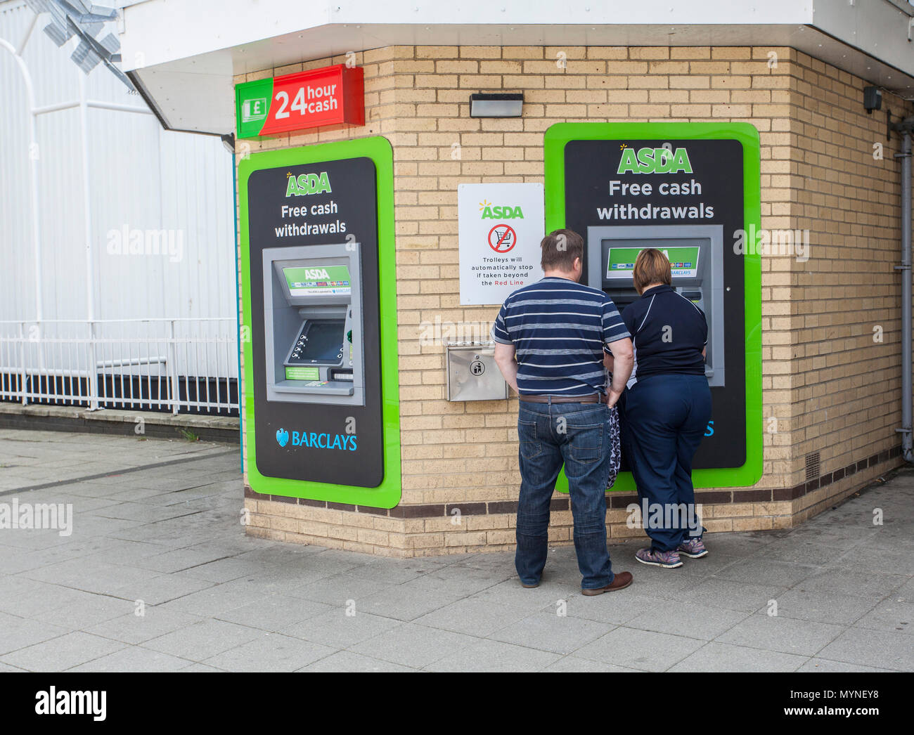 Man using hole in wall hi-res stock photography and images - Alamy