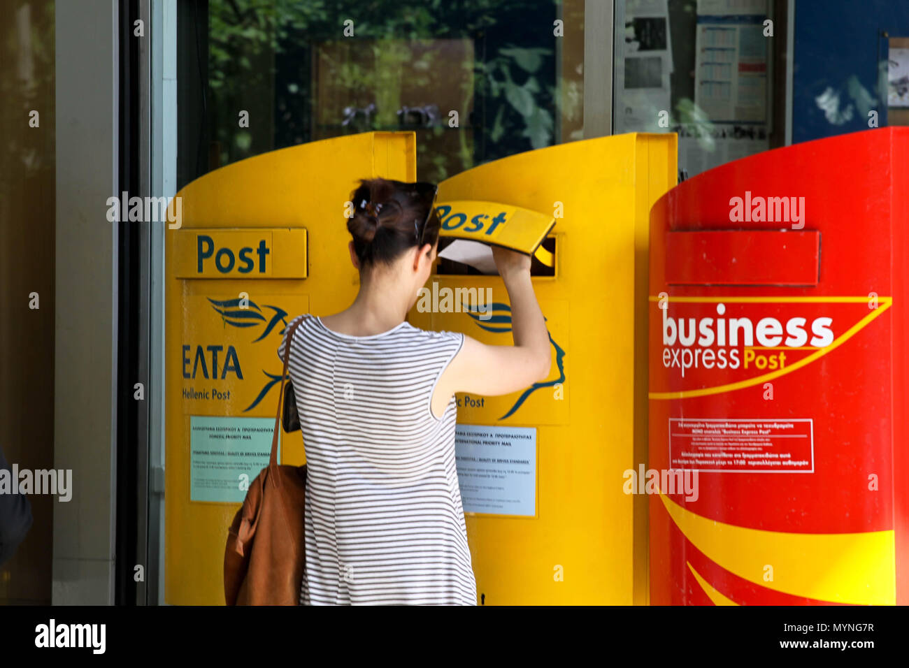 Woman posting letter in post hi-res stock photography and images - Alamy