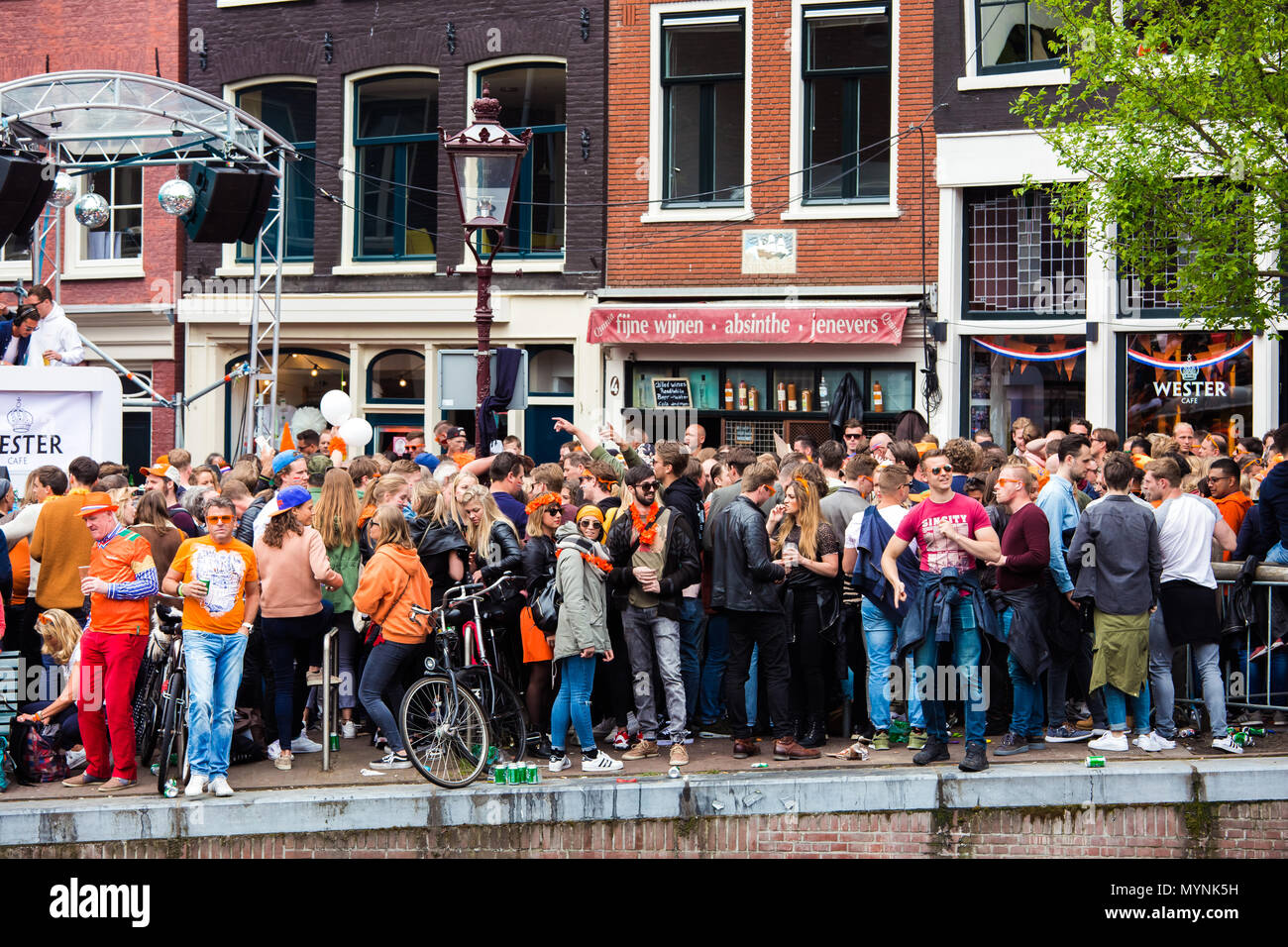 Crowd of people on the street celebrate King's day in Amsterdam city ...