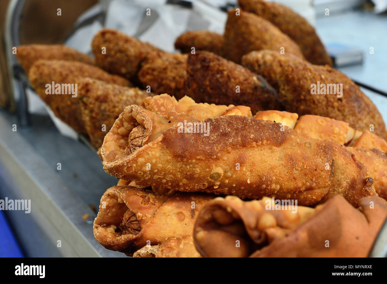 Traditional plain snacks, fried on deep oil, for buying in streets in ...