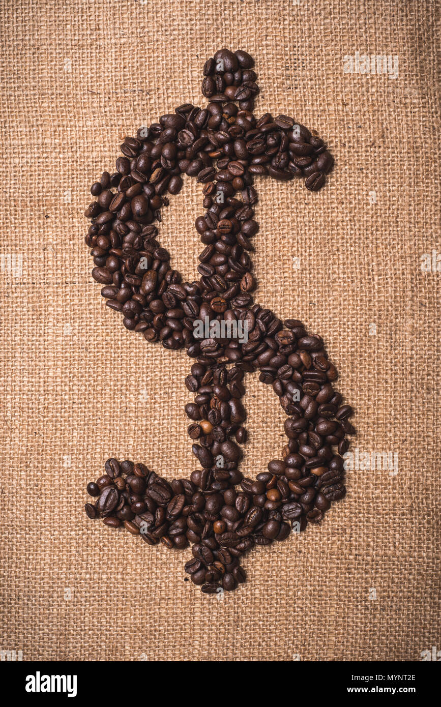 Dollar symbol written with toasted coffee beans on portrait composition ...