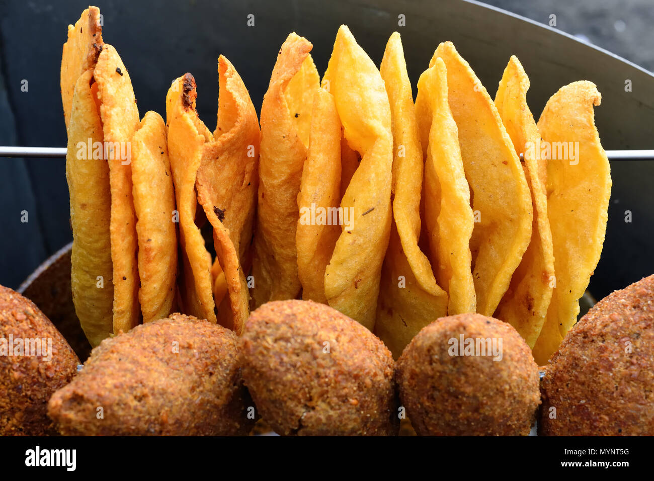 Traditional plain snacks, fried on deep oil, for buying in streets in ...
