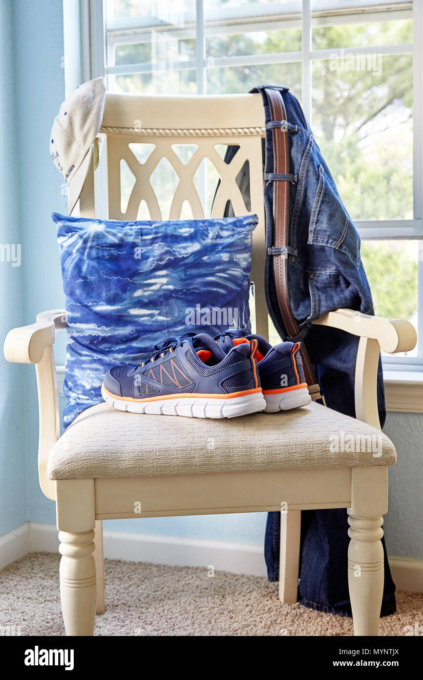 Hat and jeans on chair hi-res stock photography and images - Alamy