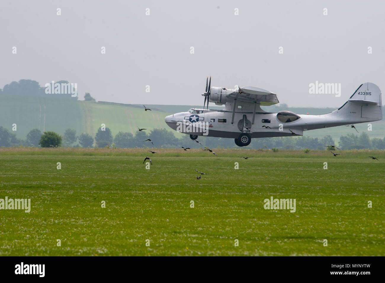 A vintage World War II-era Consolidated PBY Catalina seaplane takes off ...