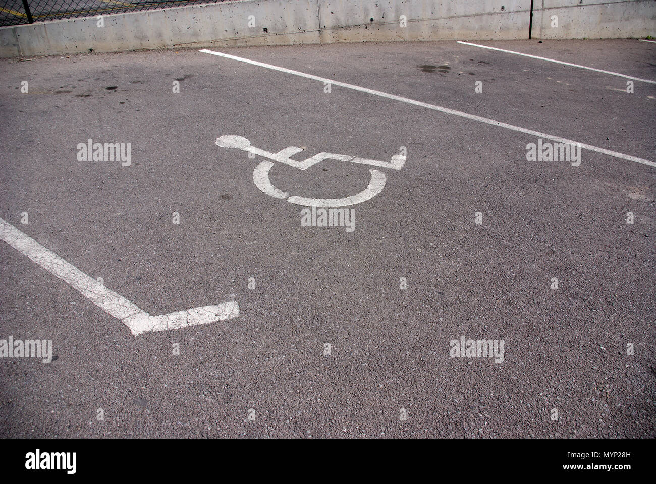 Disabled sign painted on the car parking Stock Photo - Alamy