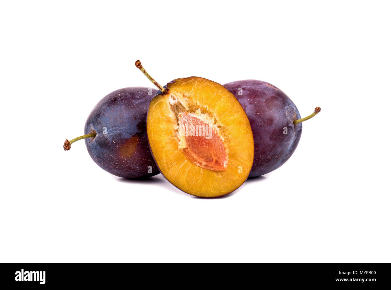 Two ripe plums with cut in half isolated on white background Stock ...