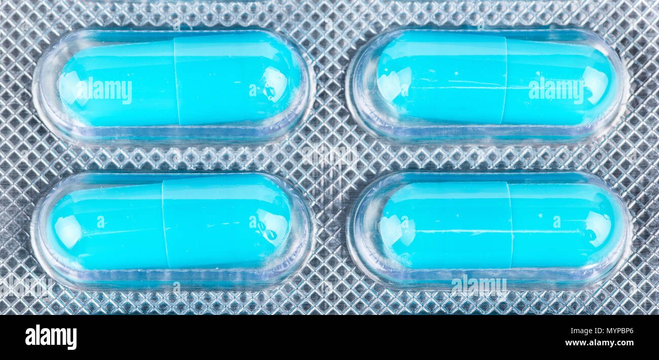 Four blue capsules in hi-res stock photography and images - Alamy