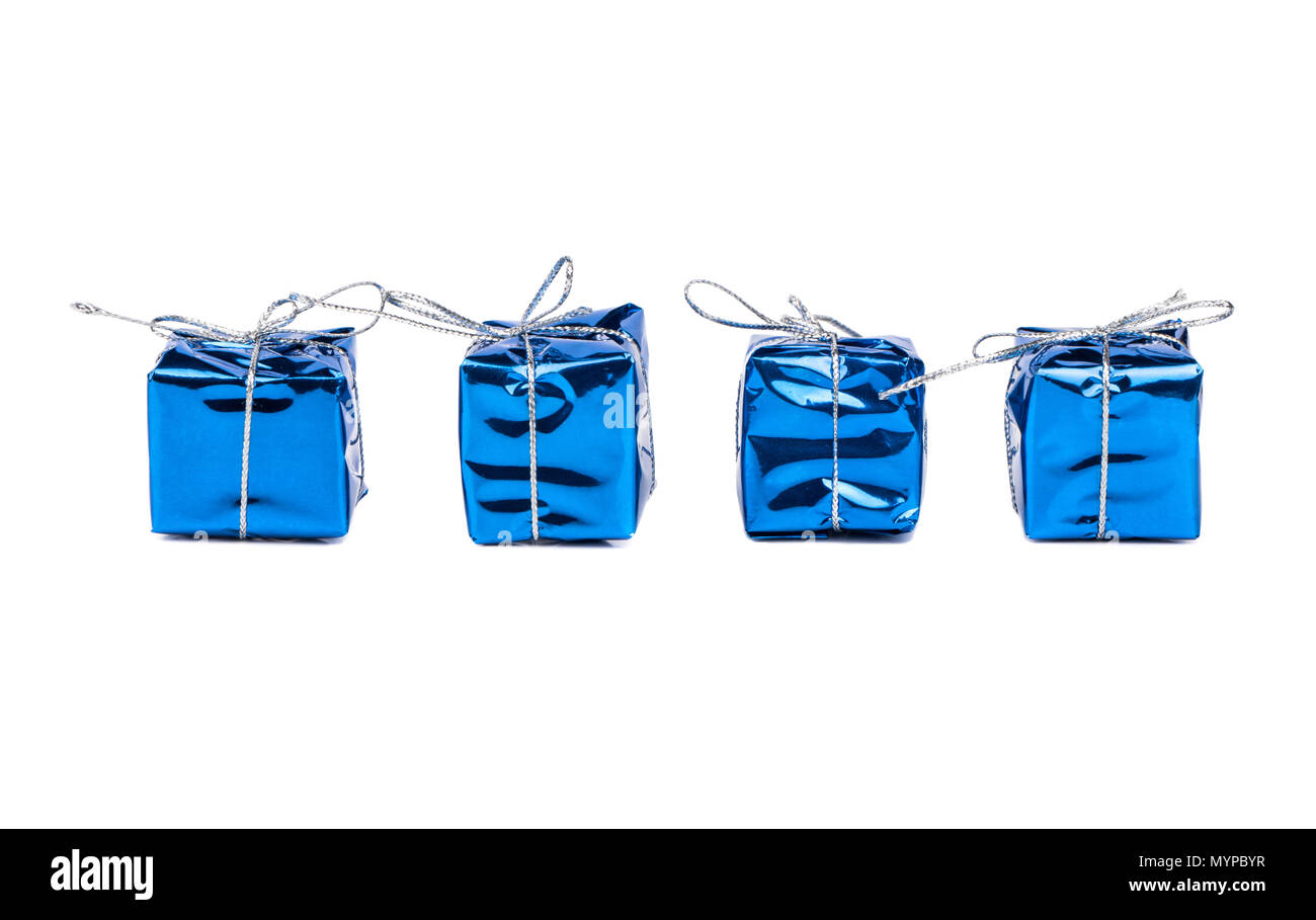 Four small blue boxes with gifts on a white background Stock Photo - Alamy