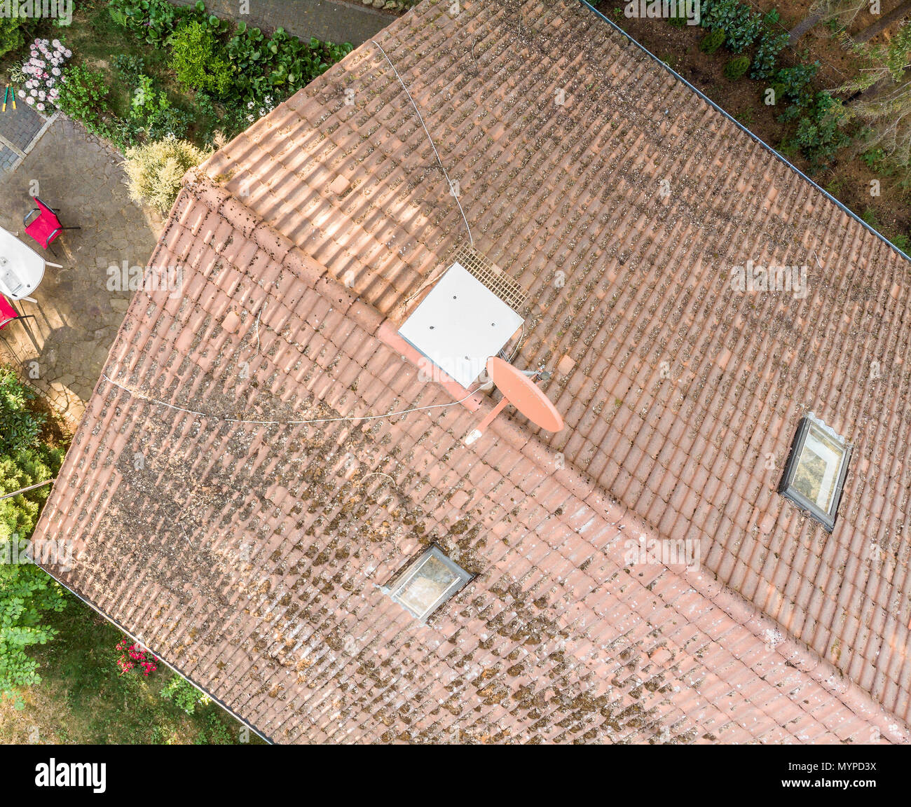 Examination of the roof of a house with a drone, aerial photograph ...