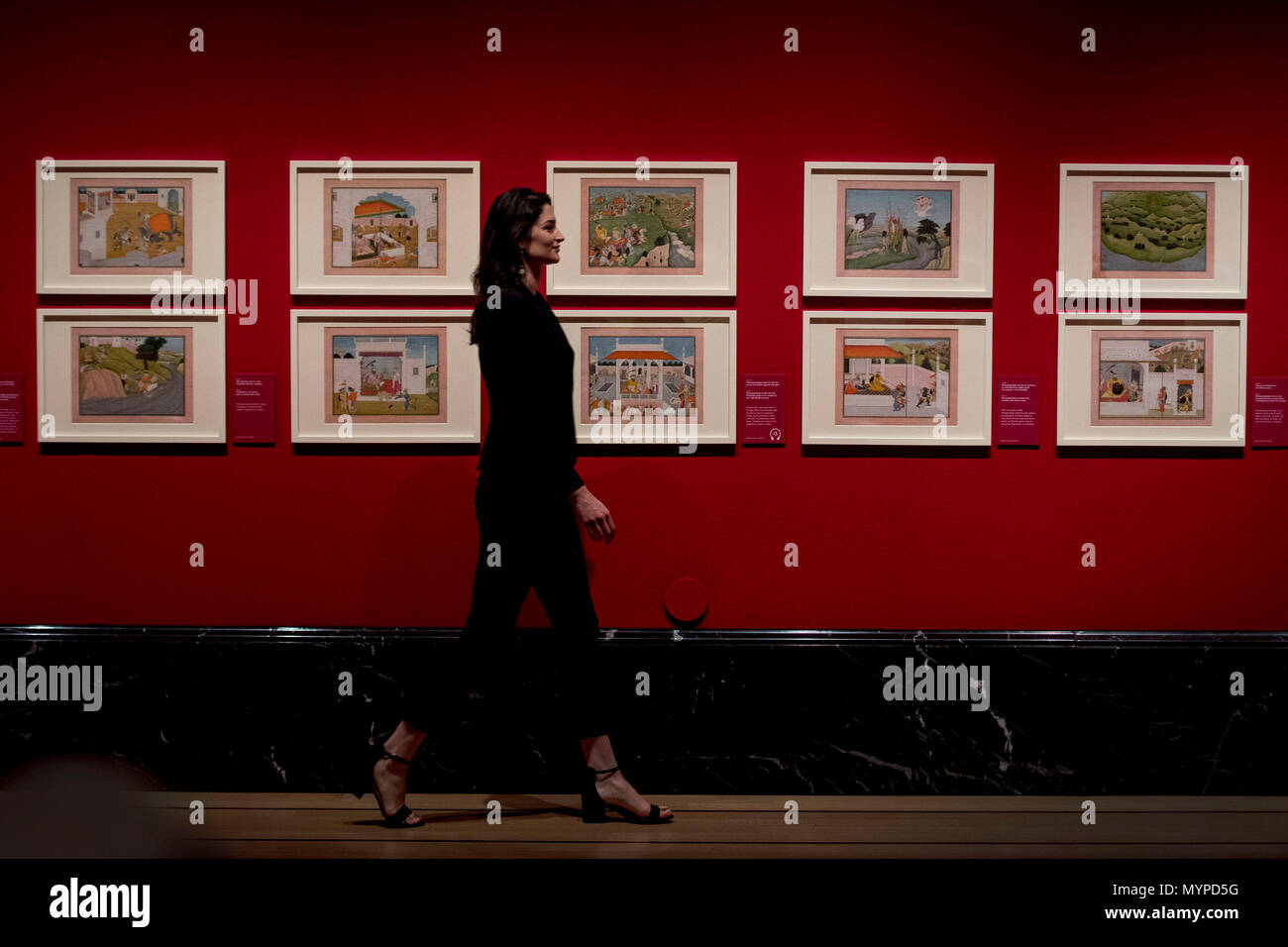 Curator emily hannam walks past paintings hi-res stock photography and ...