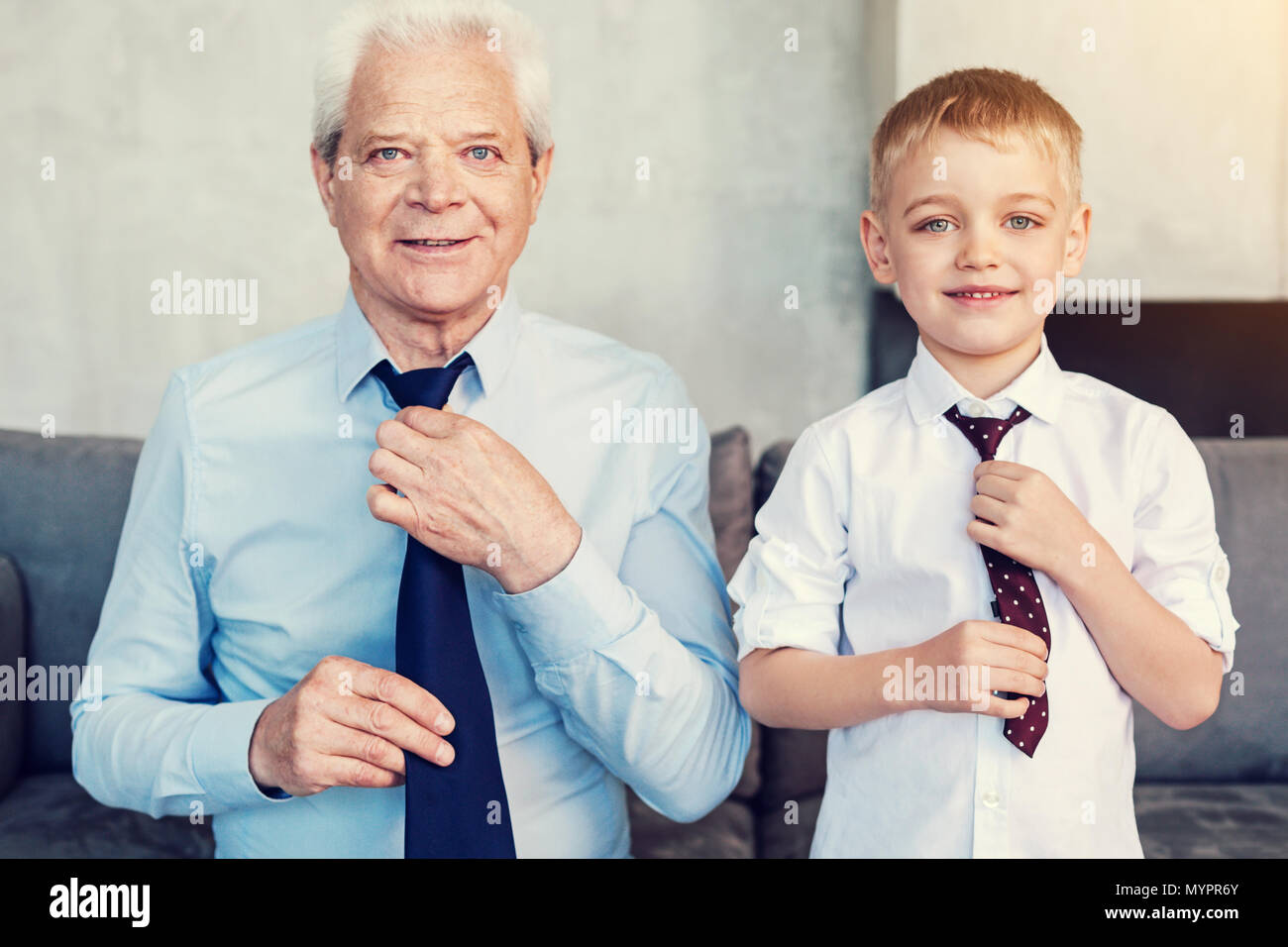 Fashionable men of different generations wearing their ties Stock Photo ...