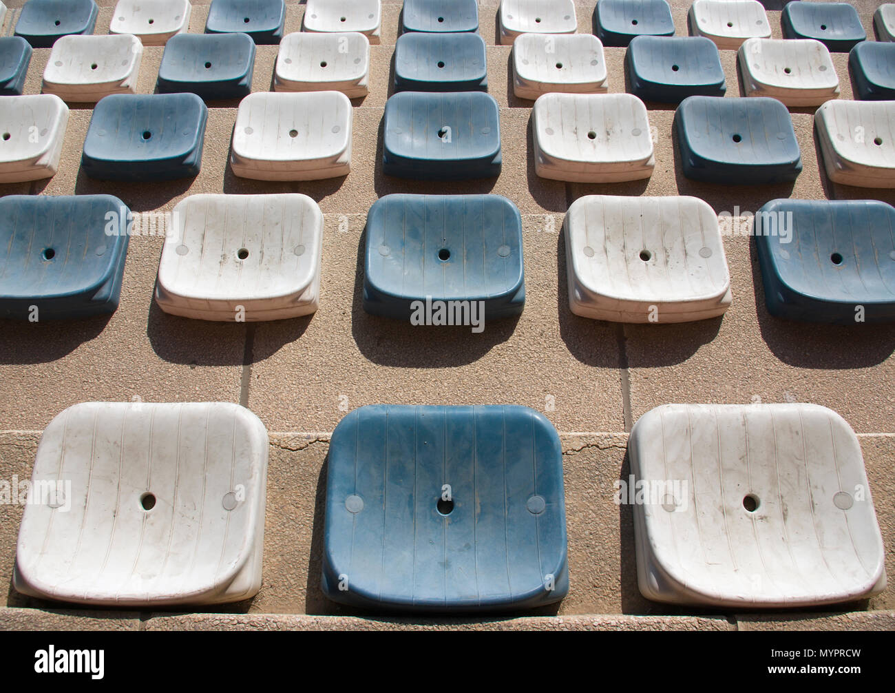 Blue and white seats at the athletics stadium Stock Photo - Alamy