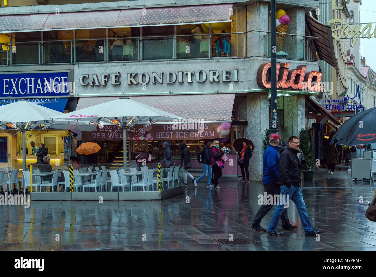 Vienna, Austria - October 22, 2017: Tourists walk in the rain in front ...