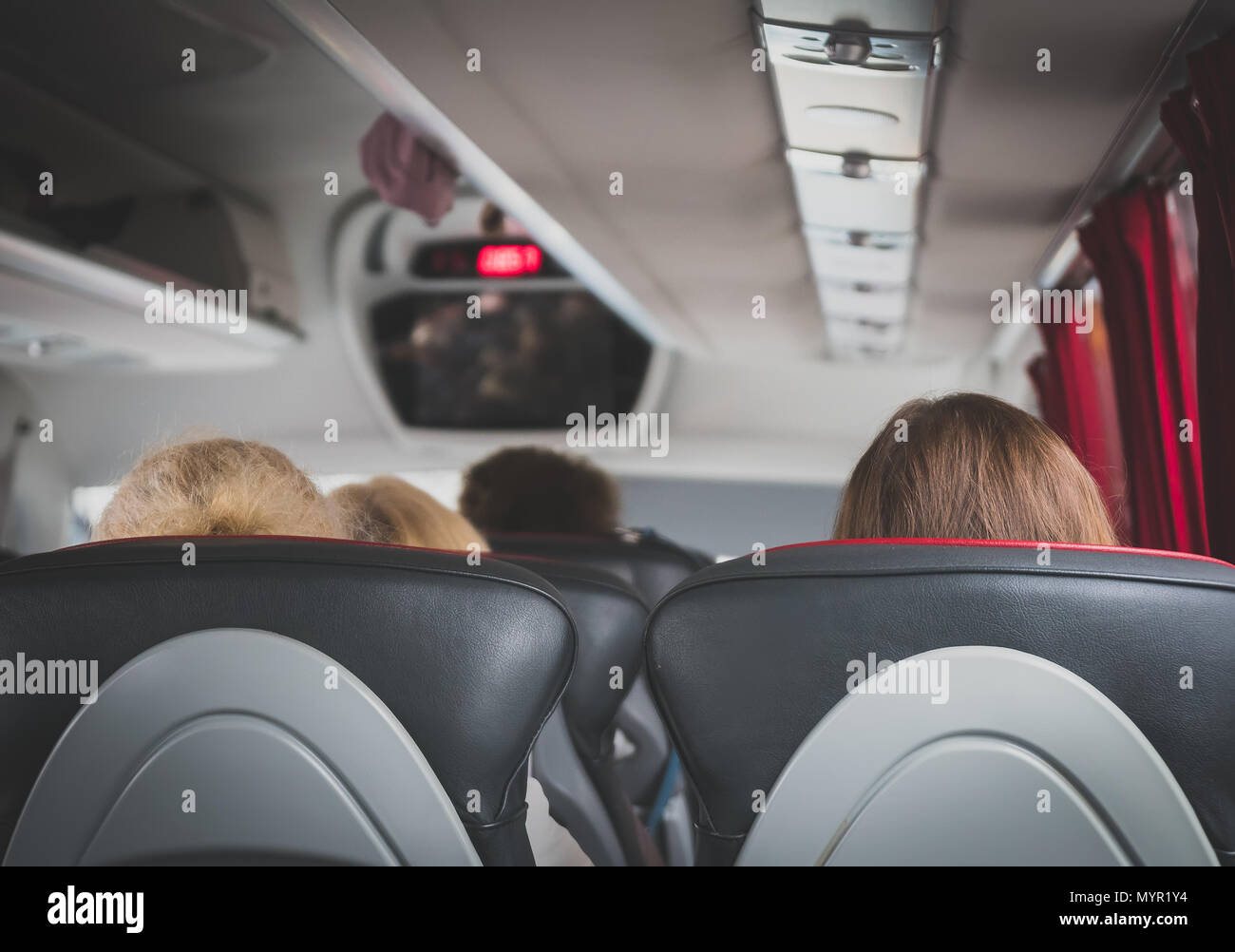 View from inside the bus with passengers Stock Photo - Alamy