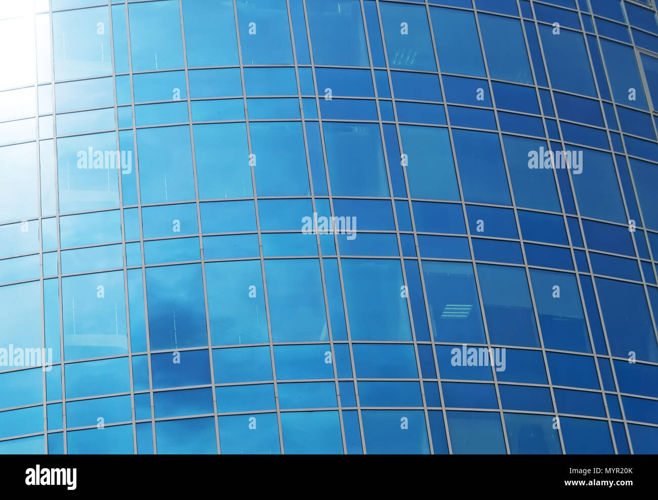 Modern round office building with square windows Stock Photo - Alamy