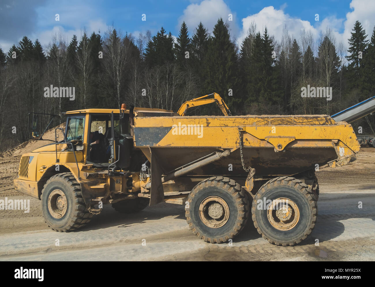 Sand tipper truck on construction site Stock Photo - Alamy