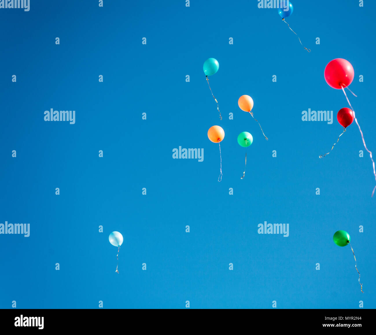 Colorful Balloons Flying Up In The Sky, Copyspace Stock Photo - Alamy