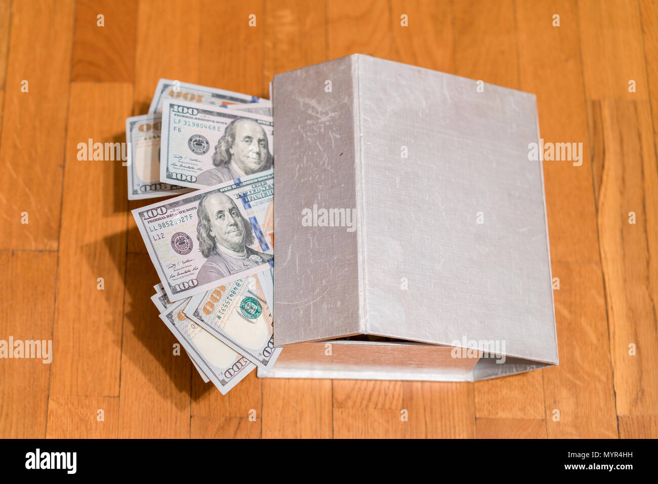 dollars in a box. Small treasure box full with money, US 100 dollar ...