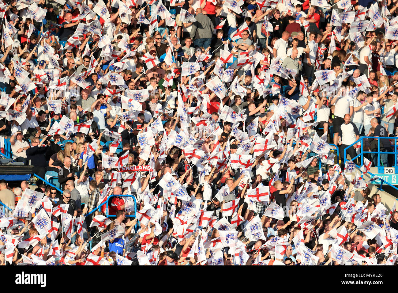 England fans in the stands wave flags during the International Friendly ...