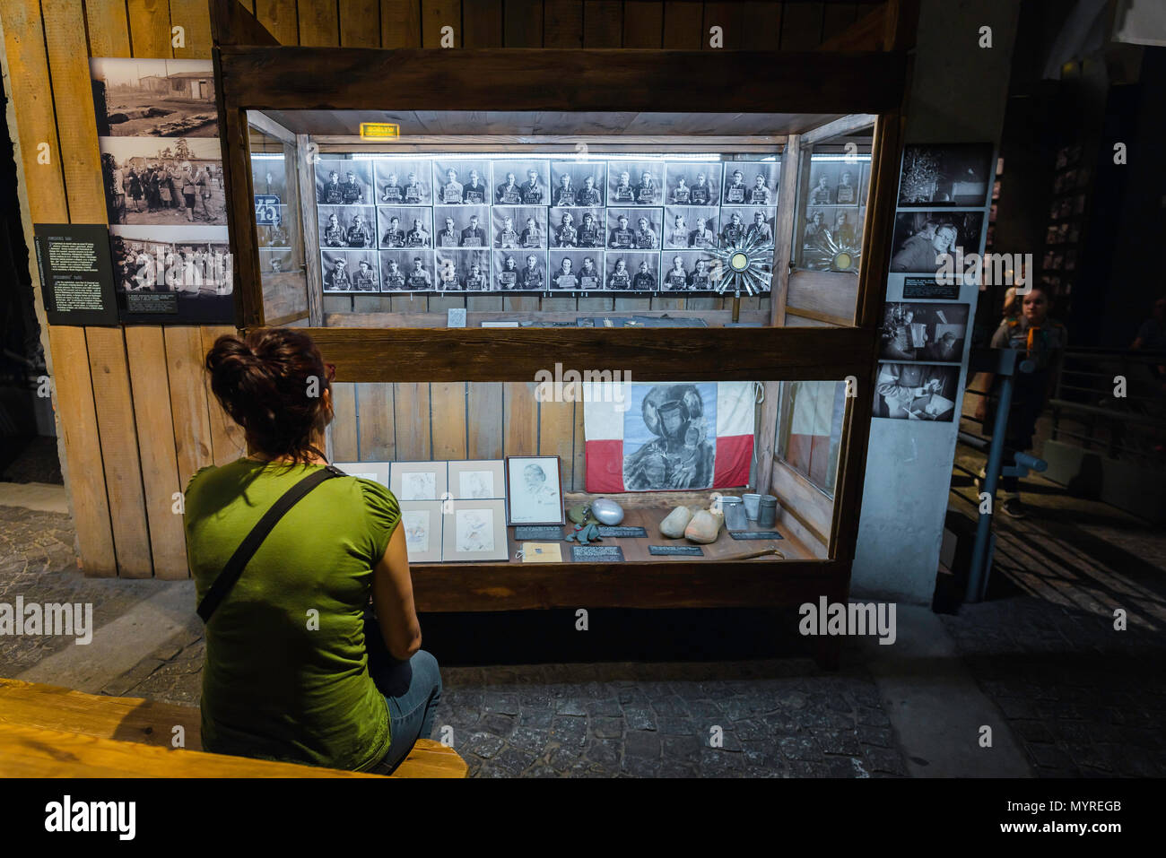 Warsaw Rising Museum, a visitor to the museum looks at photos of Polish ...