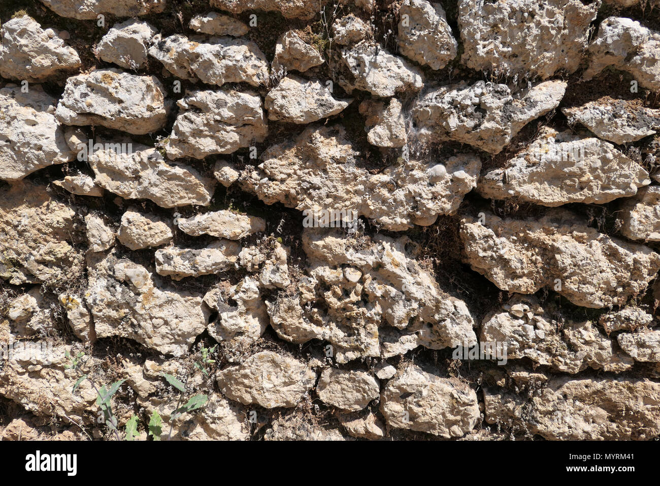 old stone wall of a house in greece. background Stock Photo - Alamy