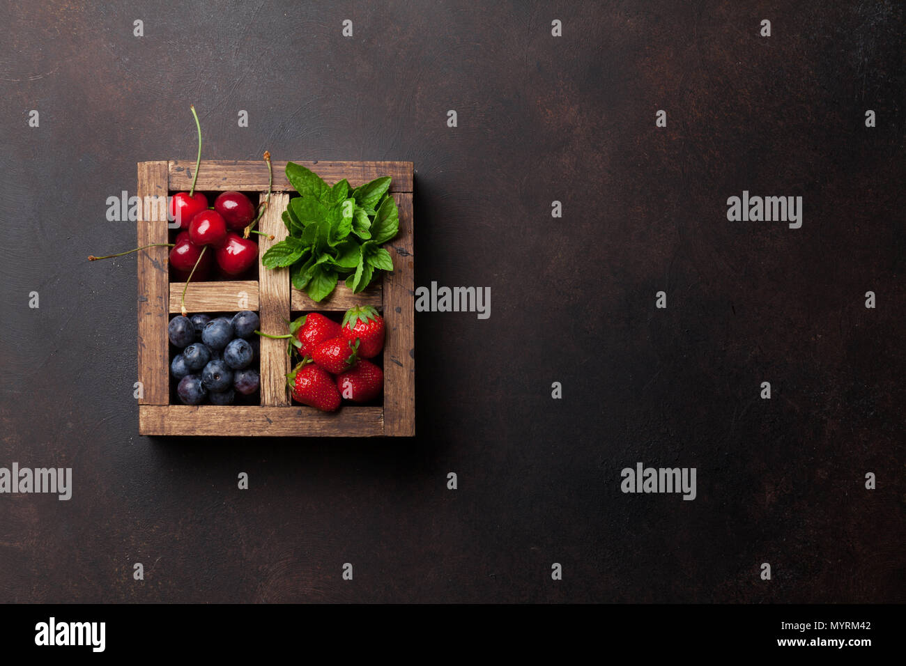 Fresh summer berries box. Cherry, blueberry, strawberry and mint. Top ...