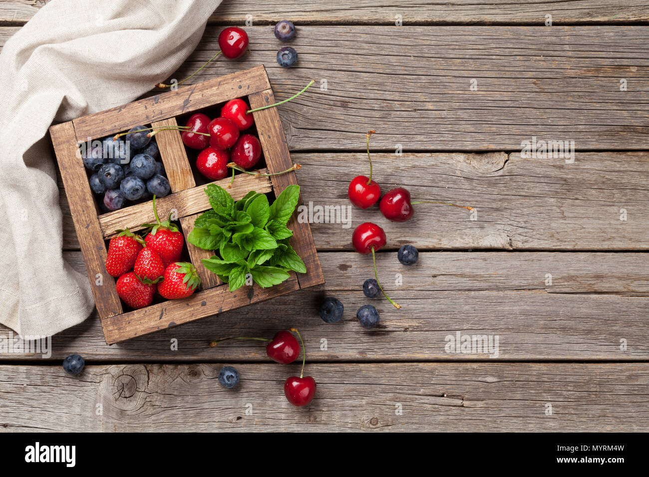 Fresh summer berries box. Cherry, blueberry, strawberry and mint. Top ...