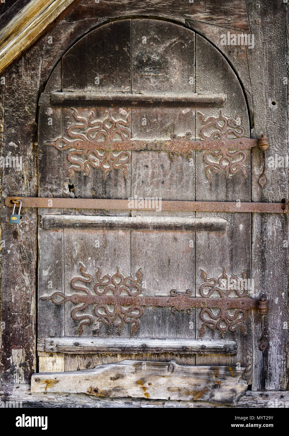 original medieval riveted wooden warehouse door, carved hinge Stock ...