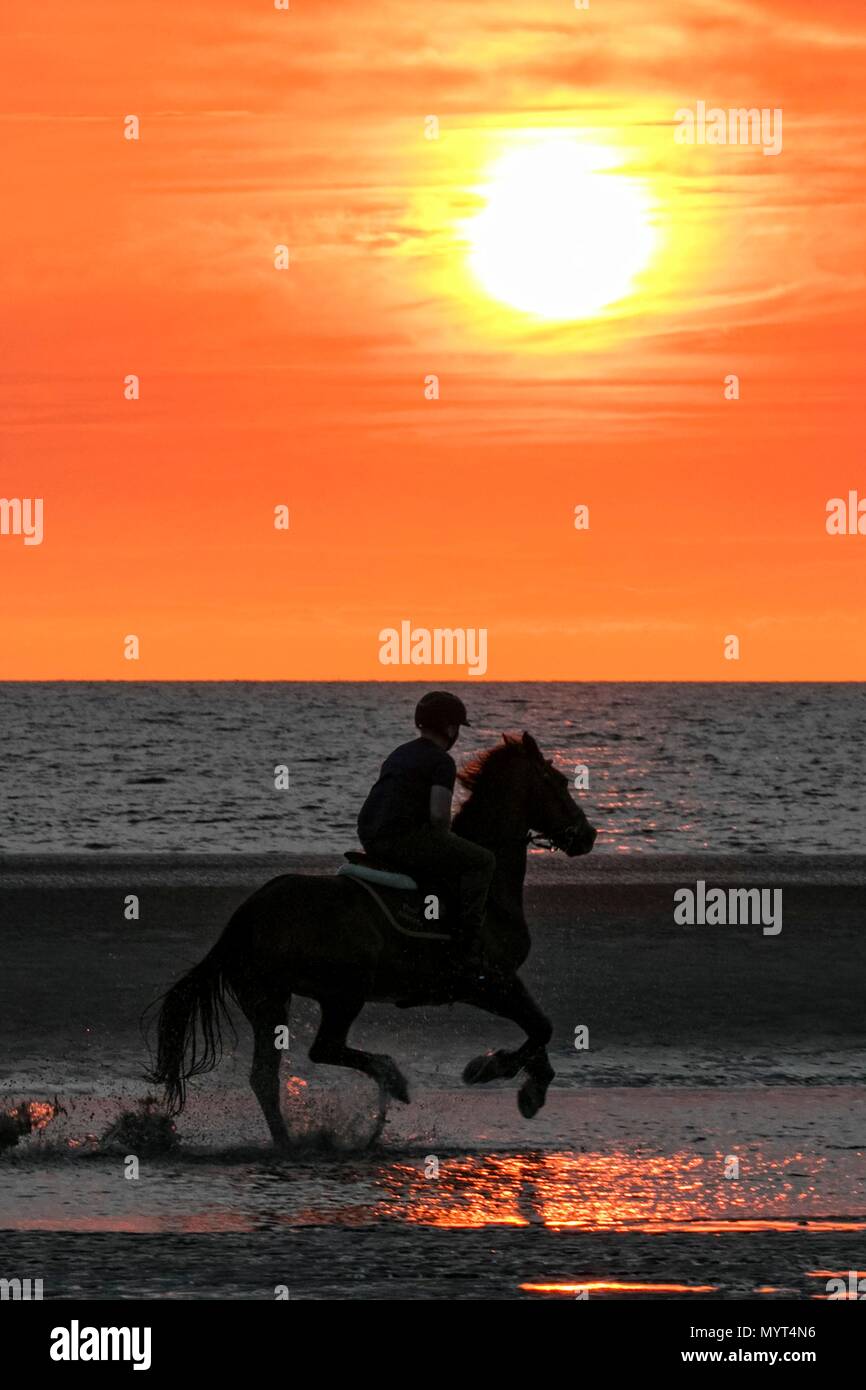 Horse Riding into Sunset, Southport, Merseyside. 7th June 2018. After a ...