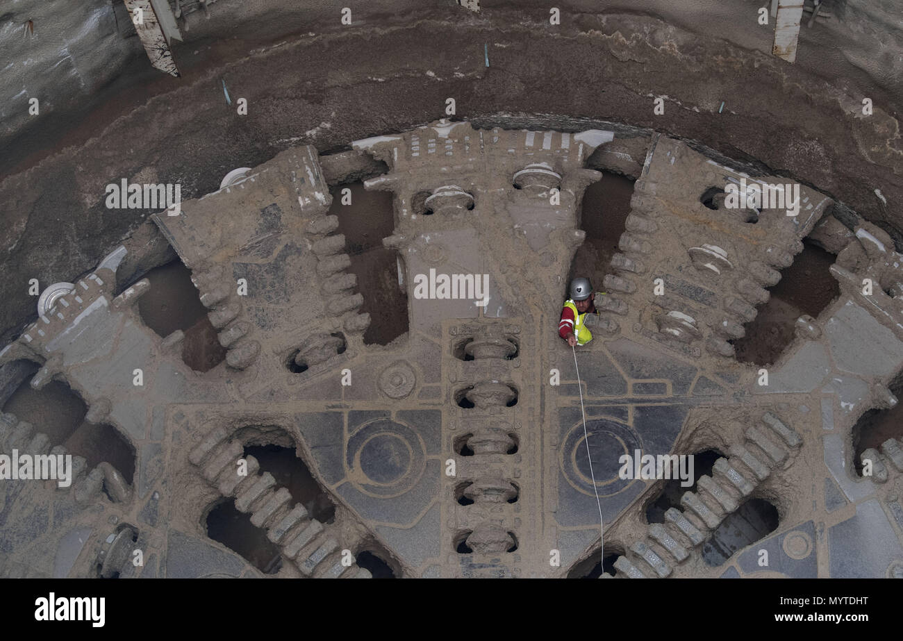 08 June 2018, Germany, Stuttgart: A tunnel worker fastening a rope on ...