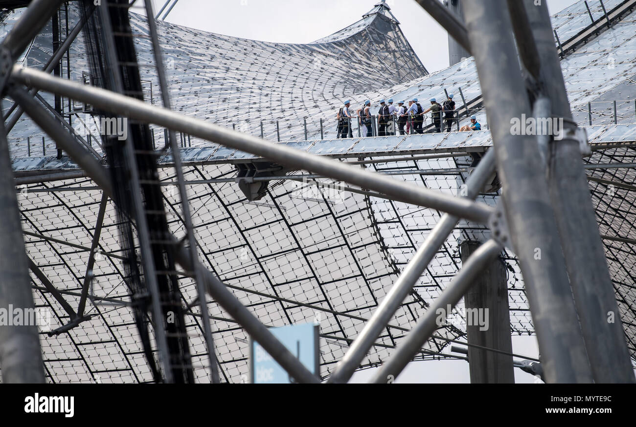 08 June 2018, Germany, Munich: Visitors to the Olympic park Standing on ...