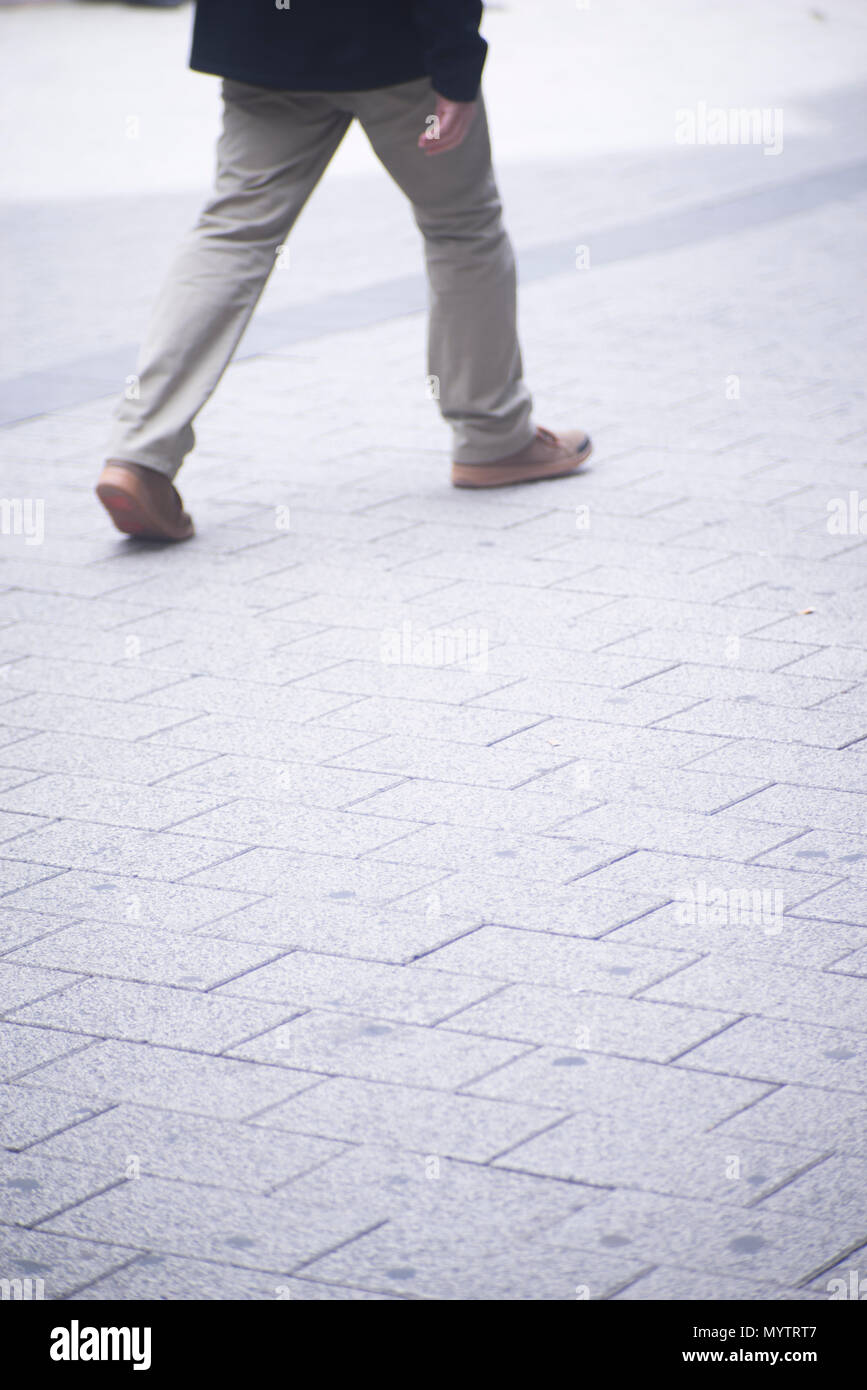 People walking in busy urban city shopping street sidewalk pavement ...