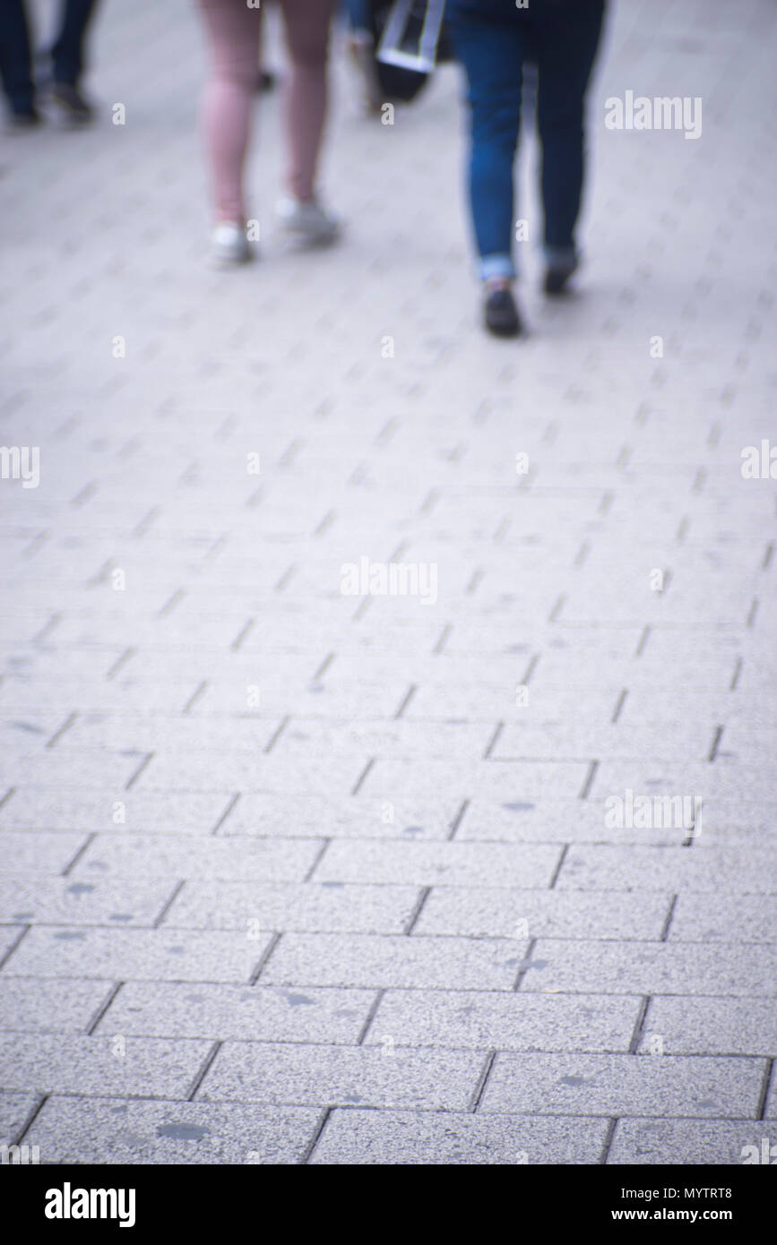 People walking in busy urban city shopping street sidewalk pavement ...