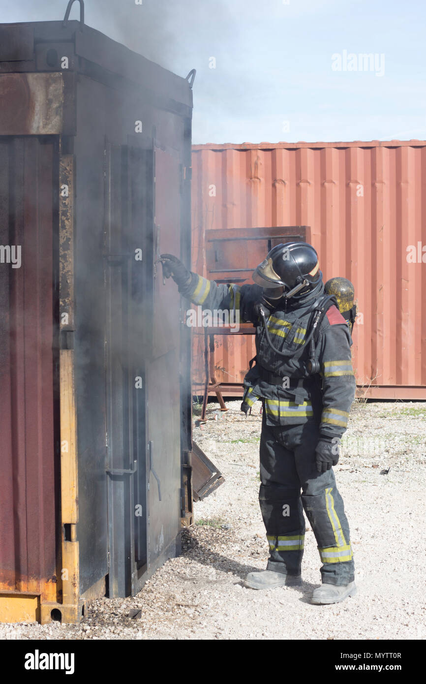 Firefighter putting out fire training station extinguisher backdraft ...