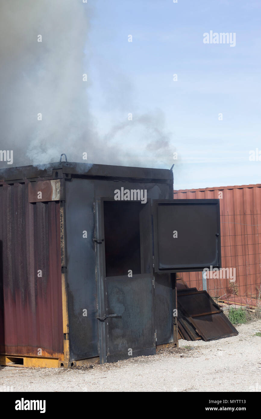 Firefighter putting out fire training station extinguisher backdraft ...
