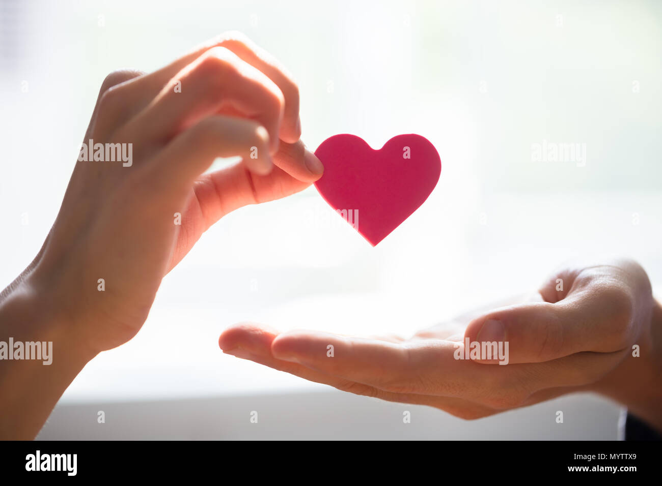 Couple heart hands close up hi-res stock photography and images - Alamy