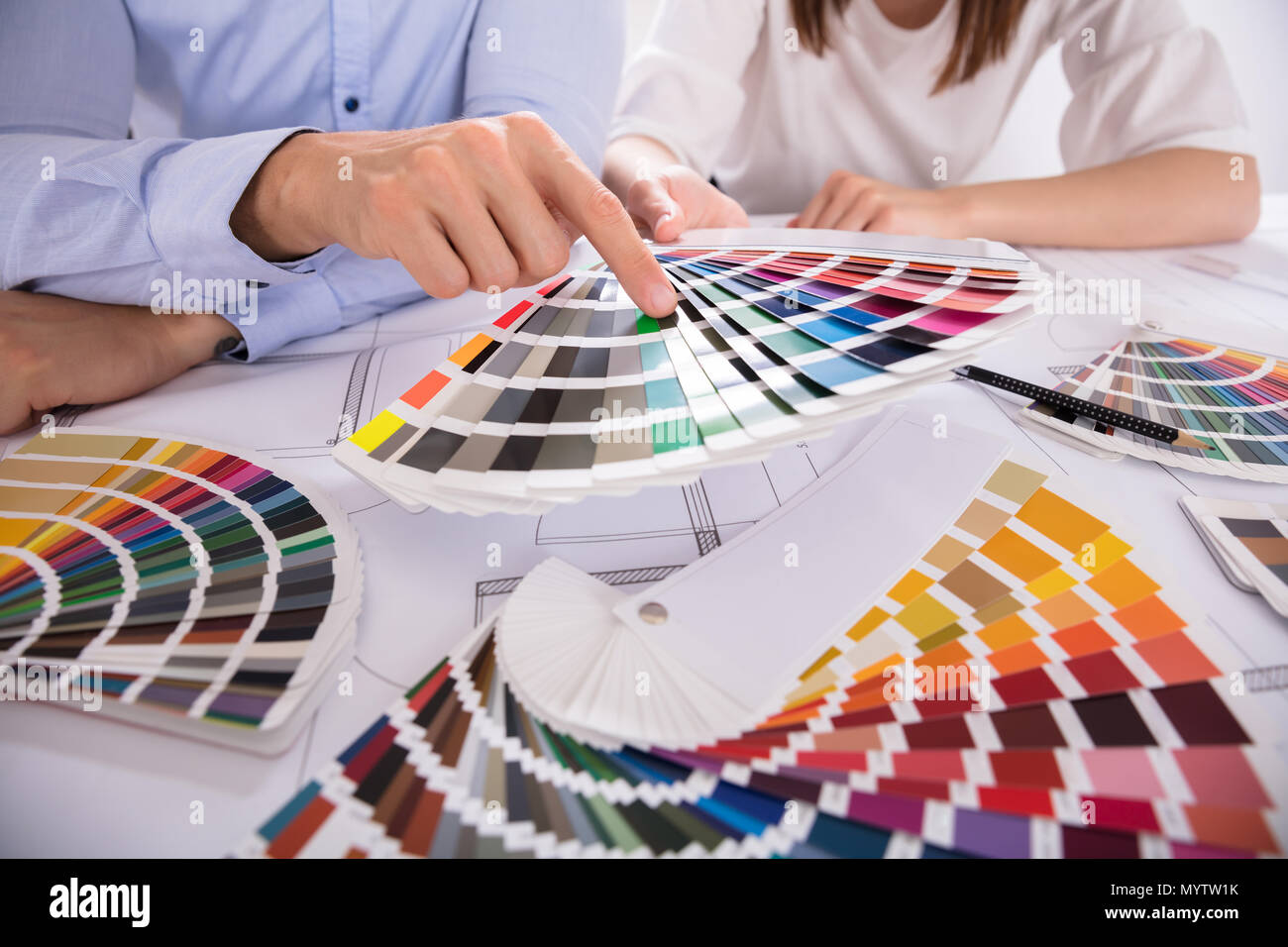 Close-up Of Two Architect's Hand Choosing Color From Various Colorful ...