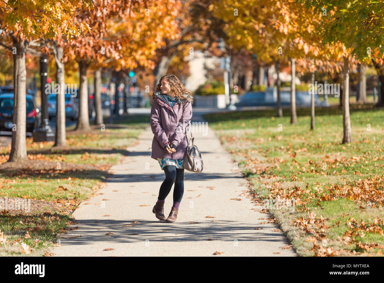 Woman walking sidewalk hi-res stock photography and images - Alamy