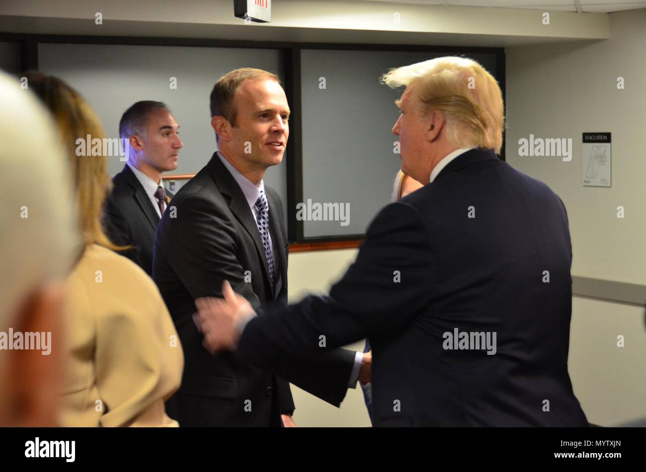 FEMA Administrator Brock Long, left, greets U.S President Donald Trump ...