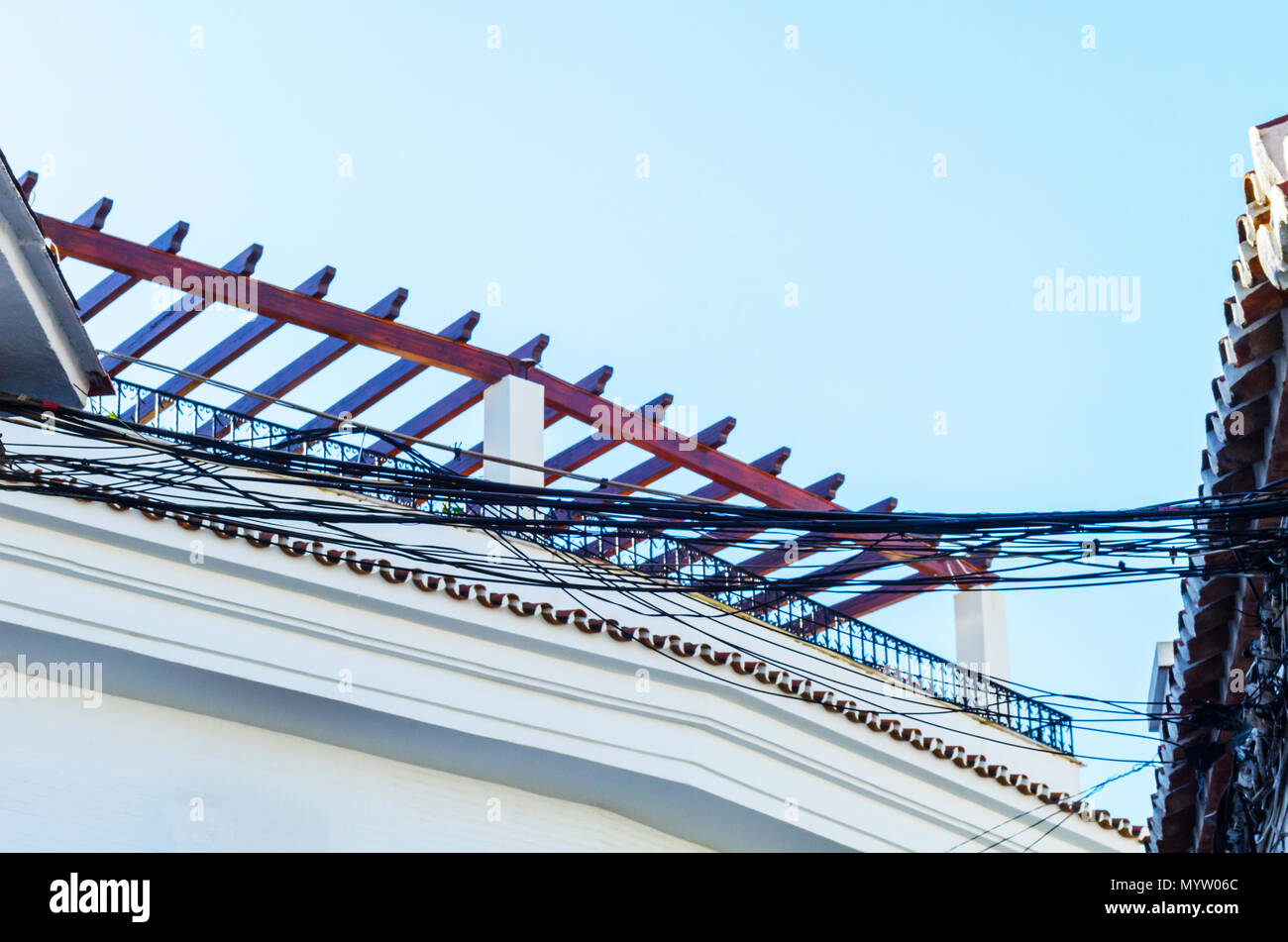 Stylish balcony with a metal railing, solid architectural element, a ...