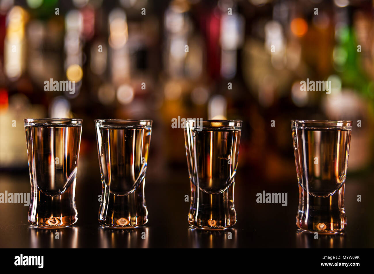 Traditional pure vodka in glasses on the background of the bar with ...