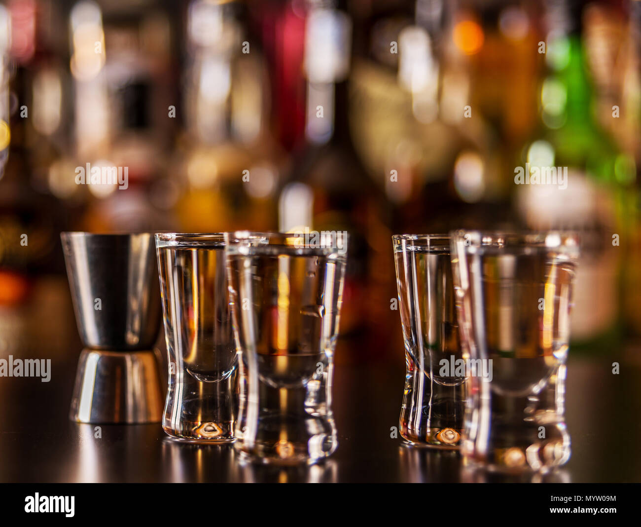 Traditional pure vodka in glasses on the background of the bar with ...