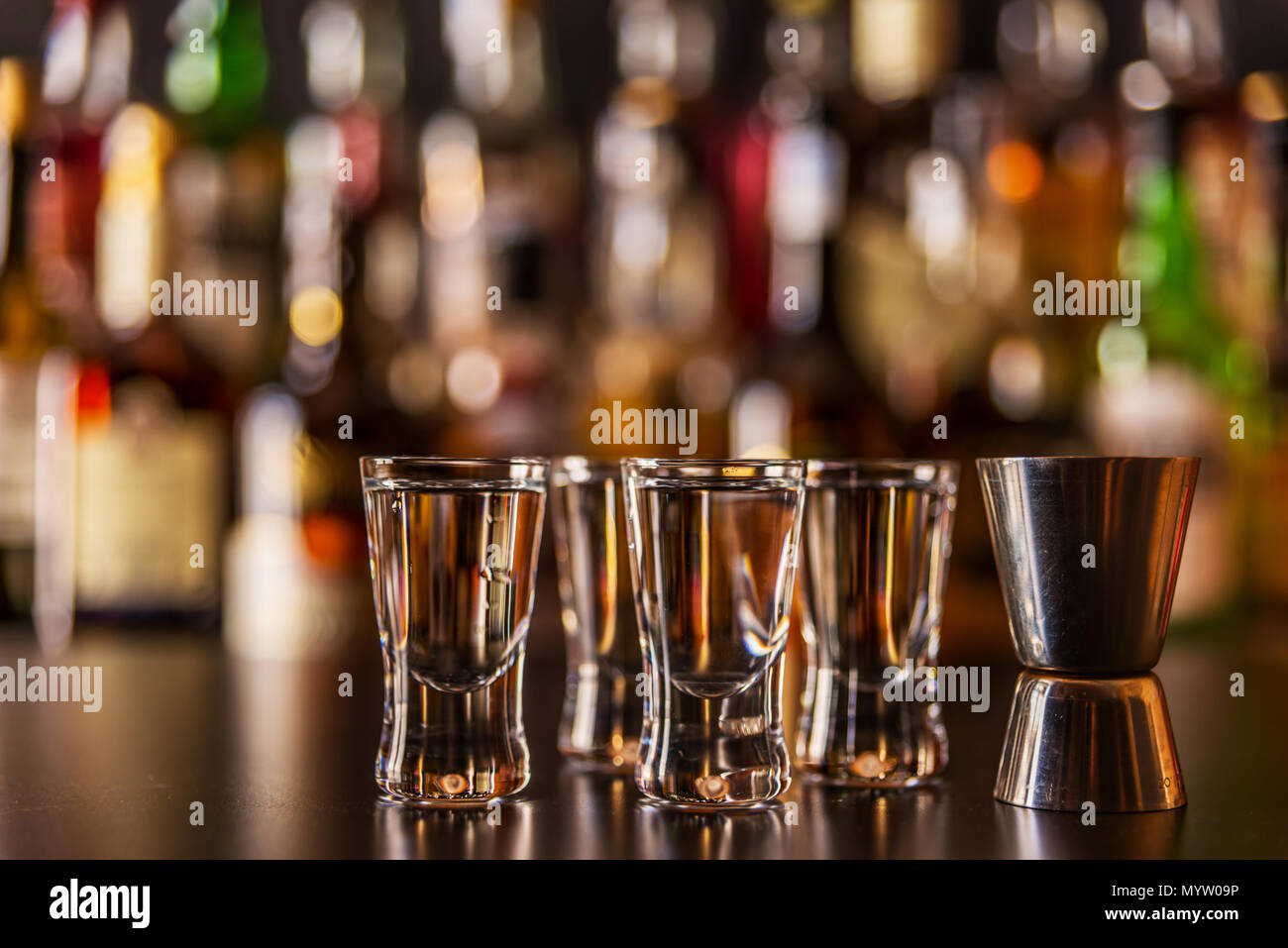 Traditional pure vodka in glasses on the background of the bar with ...
