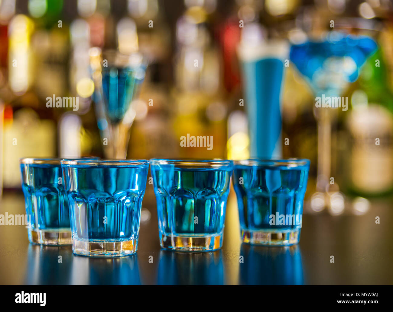 Popular blue drink shot kamikaze on the background of the bar with ...
