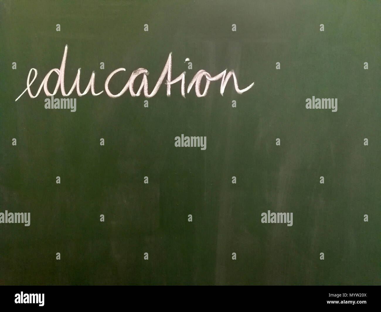 The handwritten word education on a green chalkboard Stock Photo - Alamy
