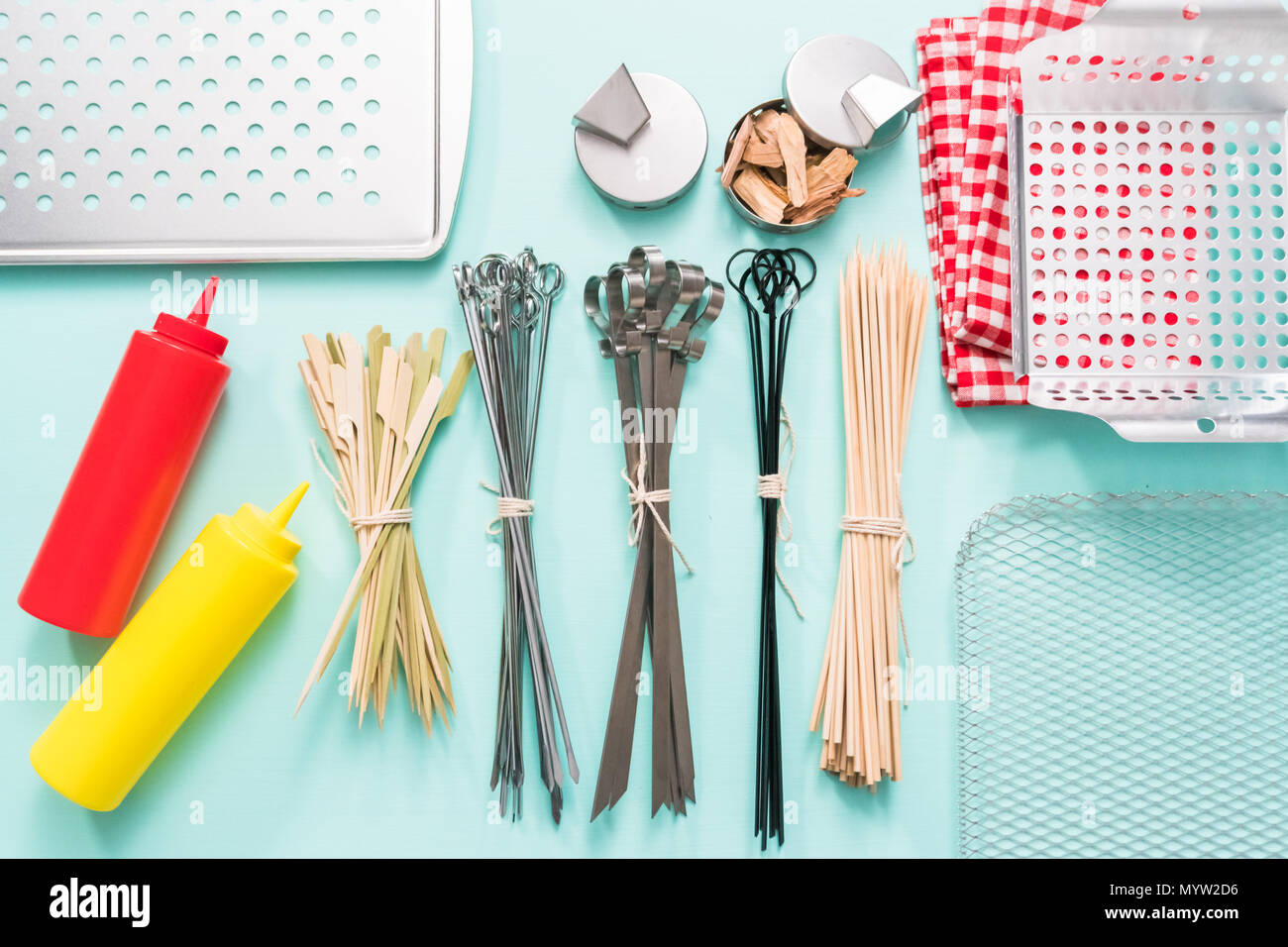Variety of grilling tools on blue background Stock Photo - Alamy