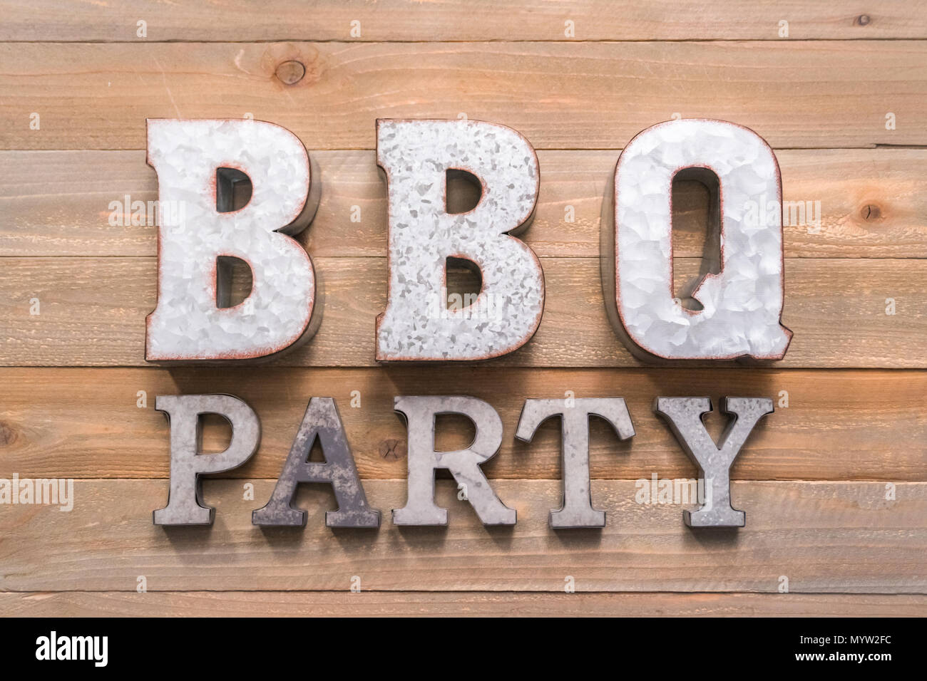 Metal BBQ Party sign with grilling tools on wood background Stock Photo ...