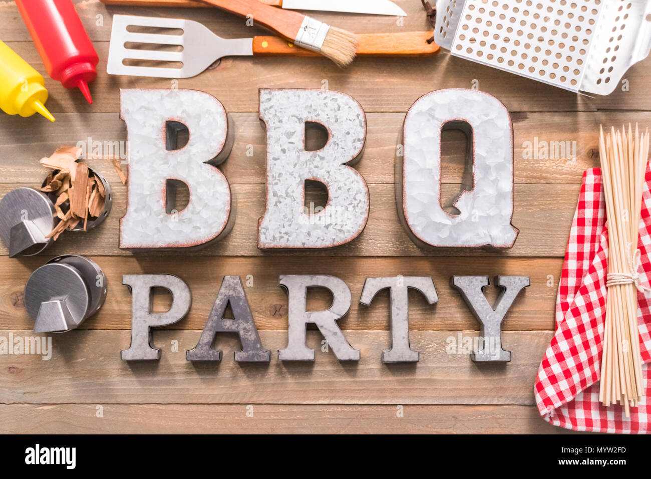 Metal BBQ Party sign with grilling tools on wood background Stock Photo ...