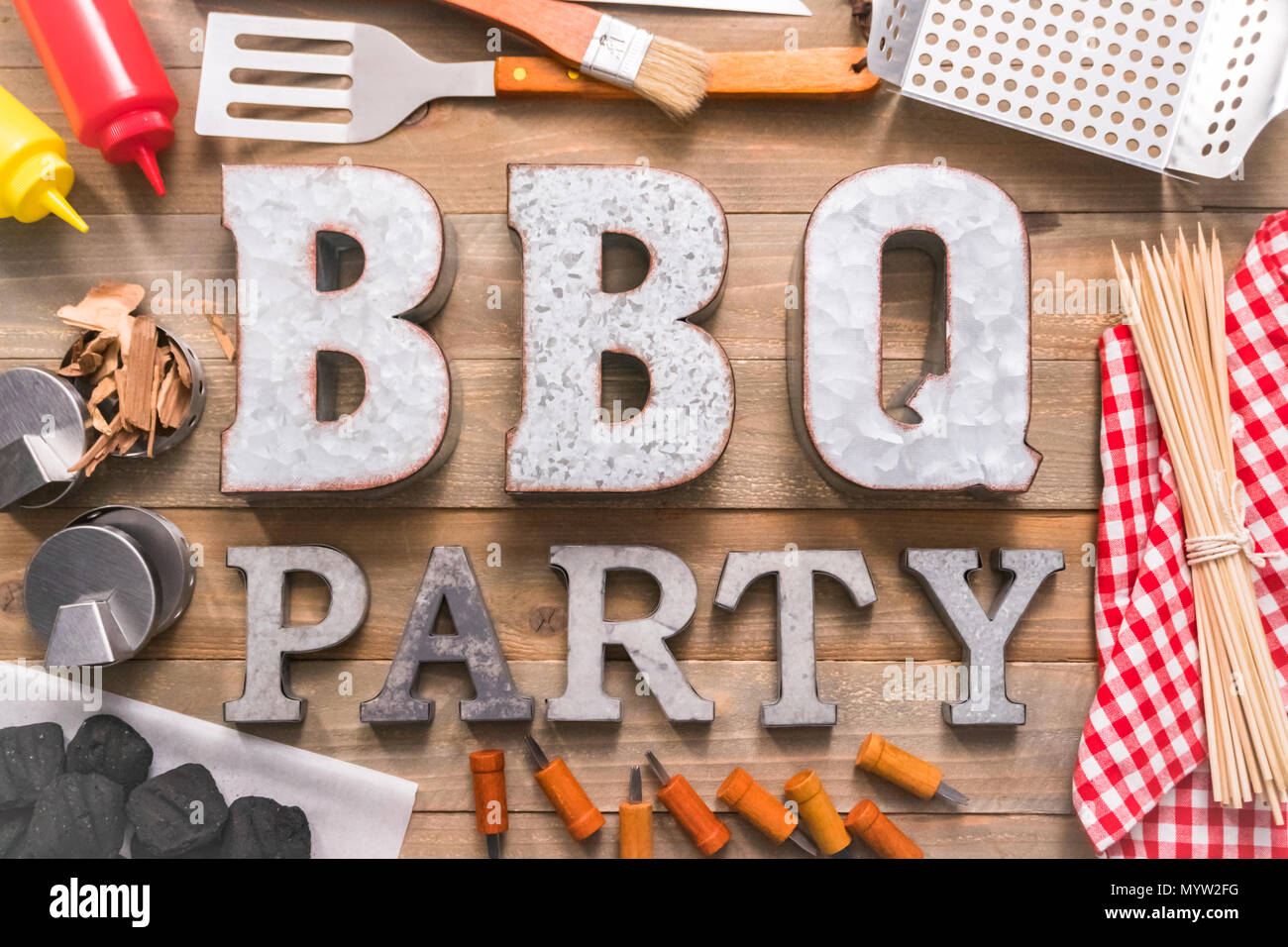 Metal BBQ Party sign with grilling tools on wood background Stock Photo ...