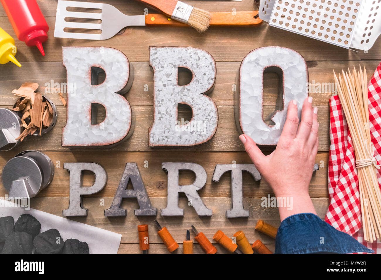 Metal BBQ Party sign with grilling tools on wood background Stock Photo ...